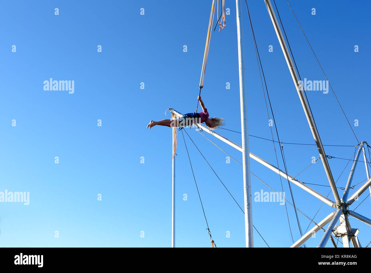 girl jumping with bungee ropes Stock Photo - Alamy