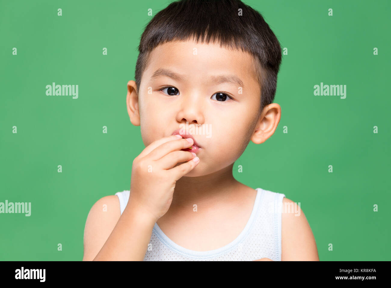 Little boy eating snack Stock Photo - Alamy