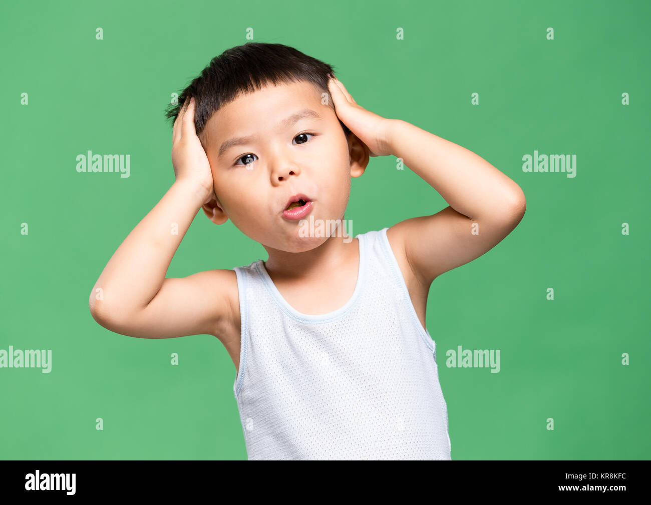 Little boy touch on his head Stock Photo - Alamy