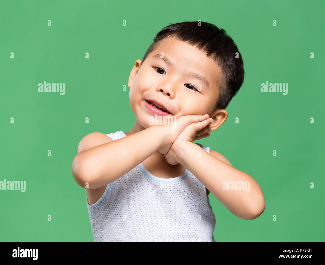 Little boy showing a sleeping gesture Stock Photo - Alamy