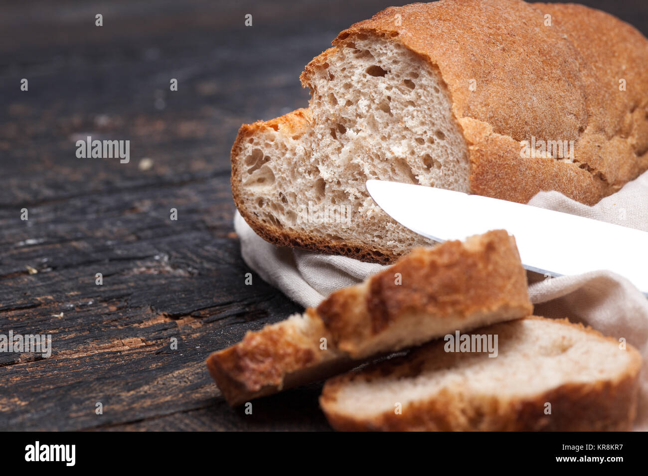 Rustic bread on wood table. Dark woody background with free text space ...
