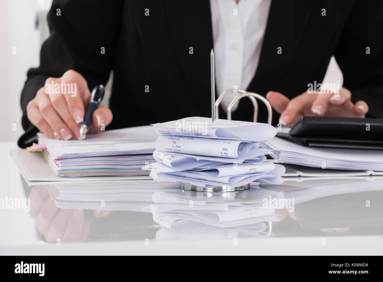 Accountant Calculating Tax At Desk Stock Photo - Alamy