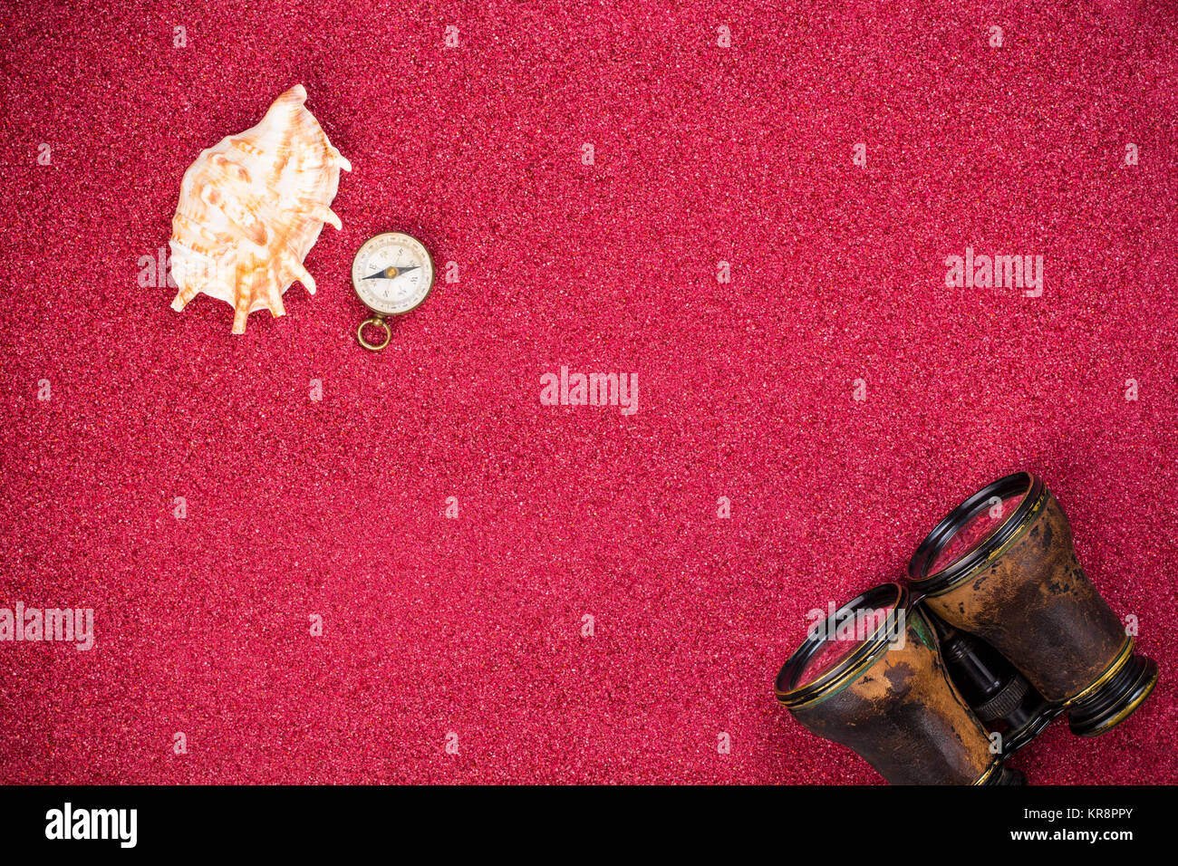 Compass with shell and binoculars Stock Photo - Alamy