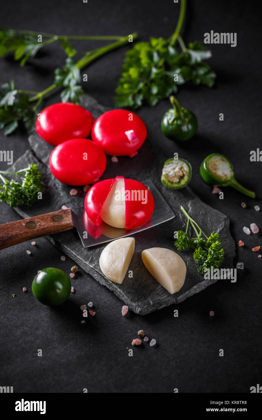 Cheddar cheese in red wax Stock Photo - Alamy