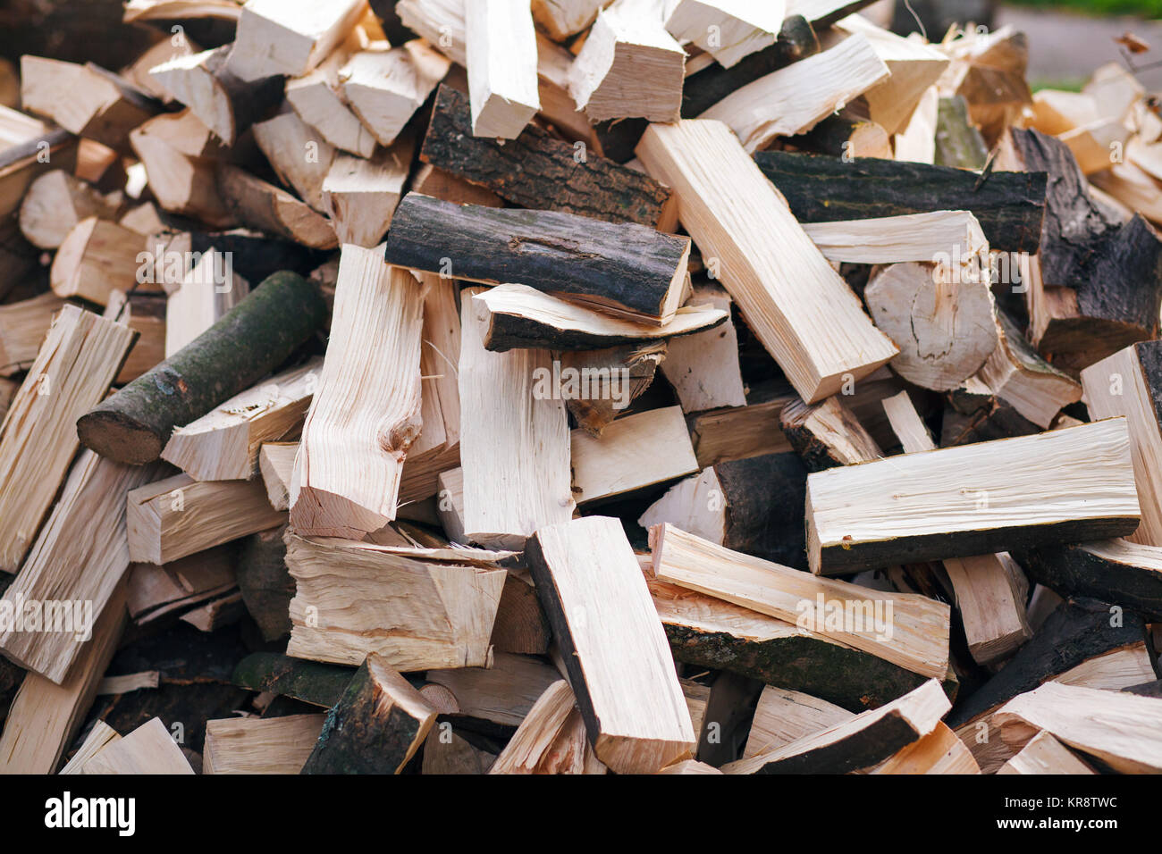 chopped firewoods on a stack Stock Photo - Alamy