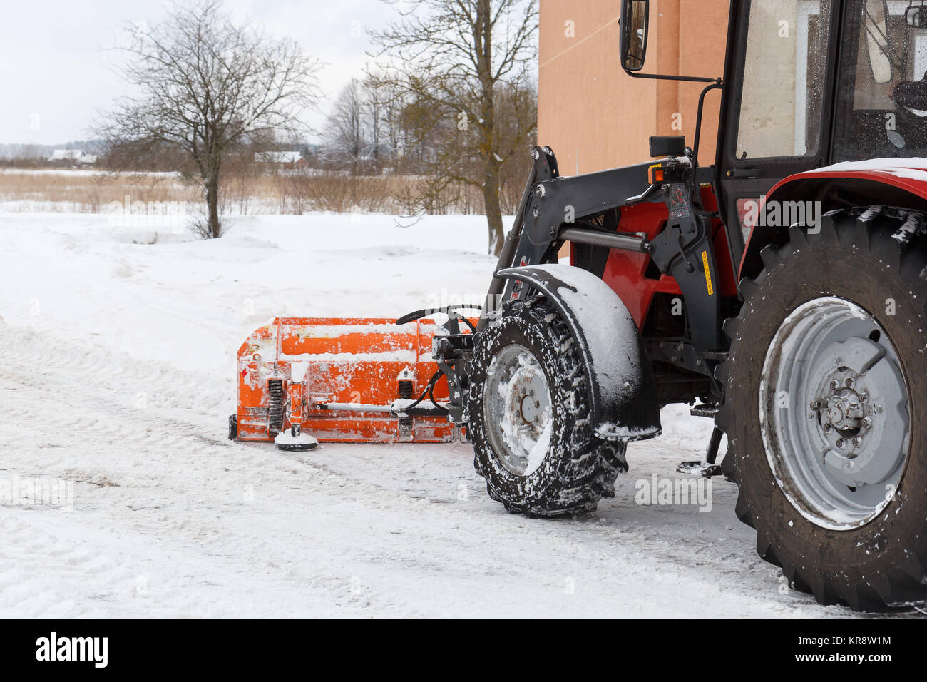 Snow cleaning tractor Stock Photo - Alamy