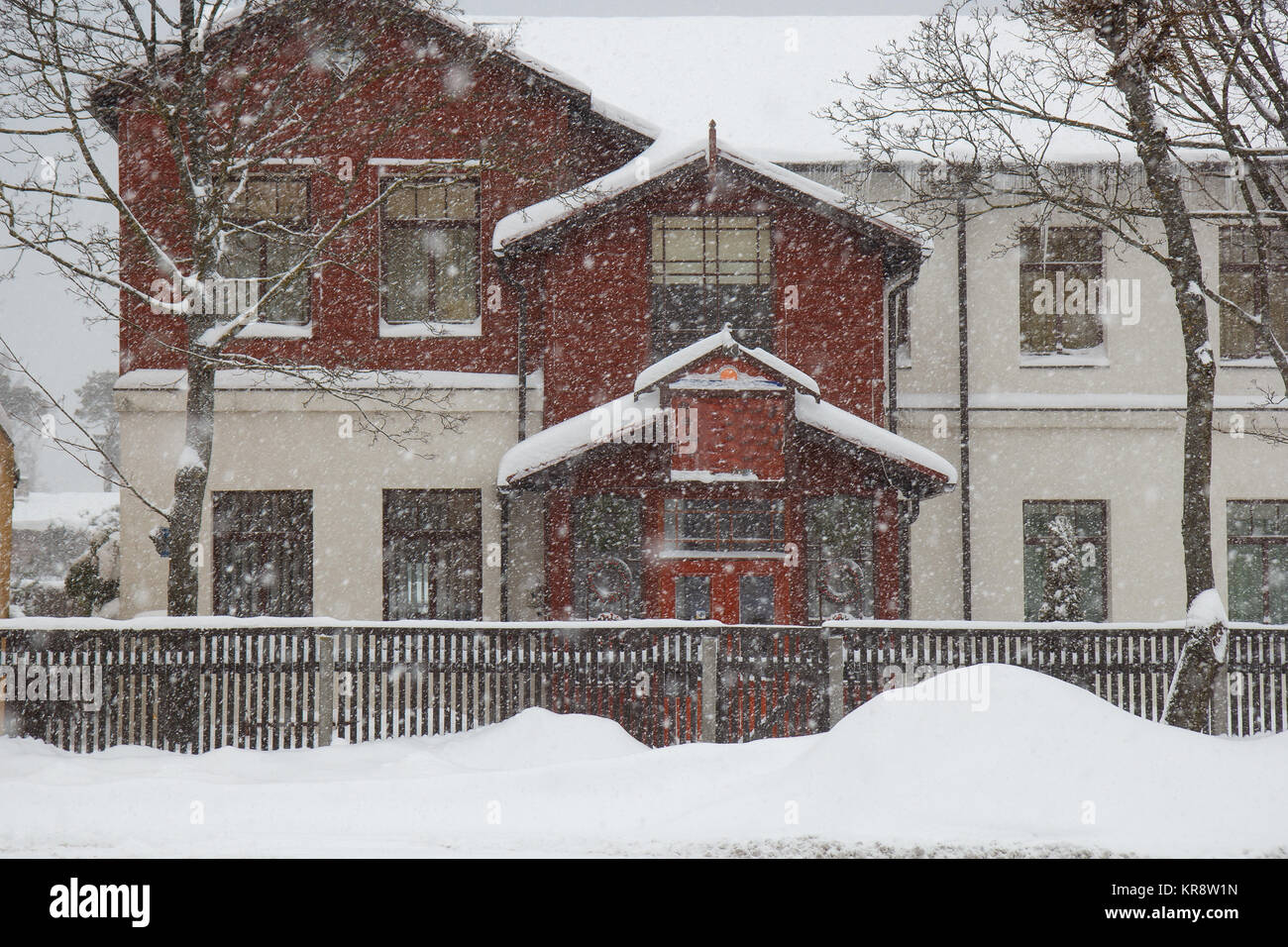 Snowing by a house Stock Photo - Alamy