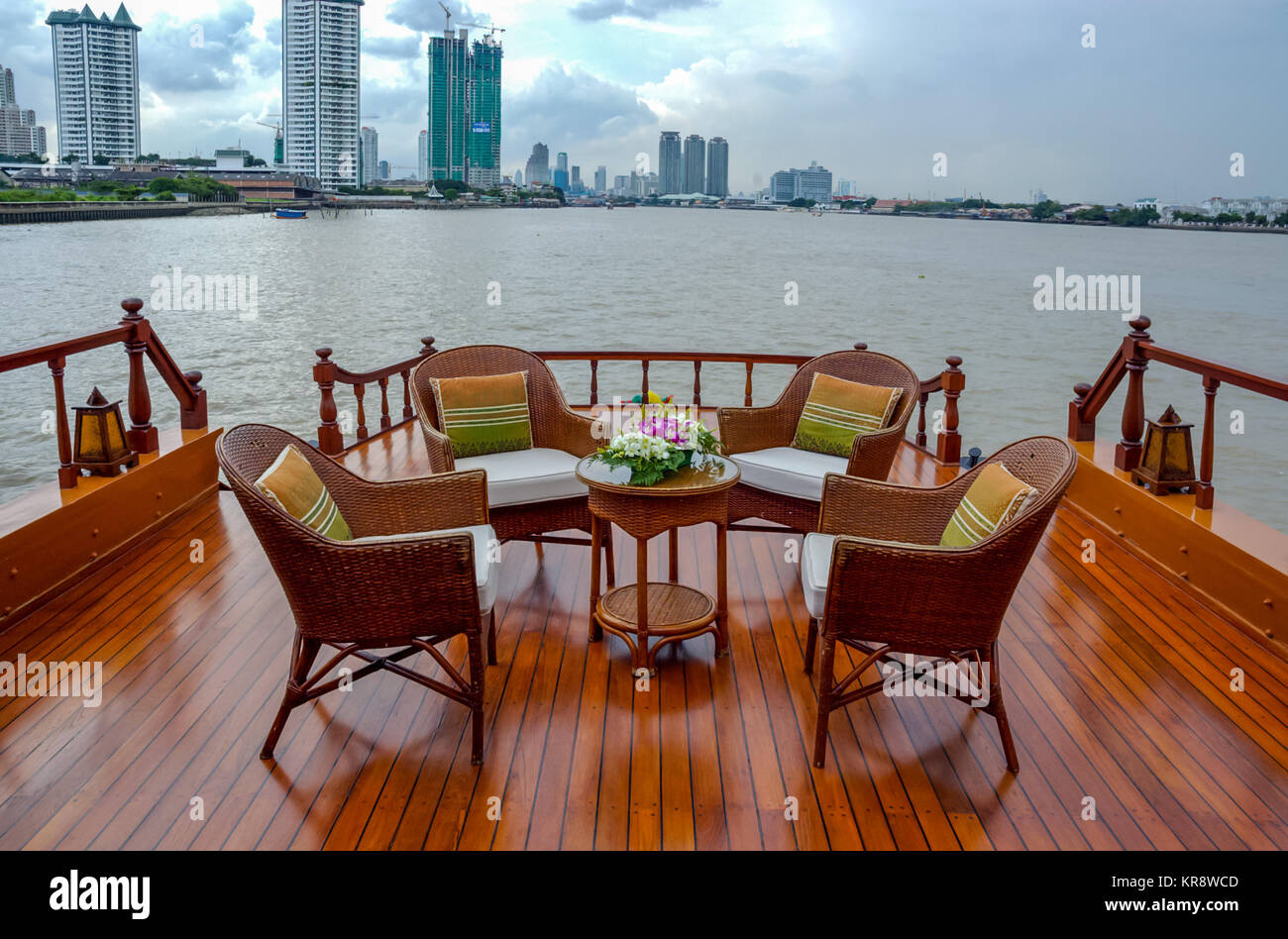 Rattan furniture, table, chairs on river boat Stock Photo - Alamy