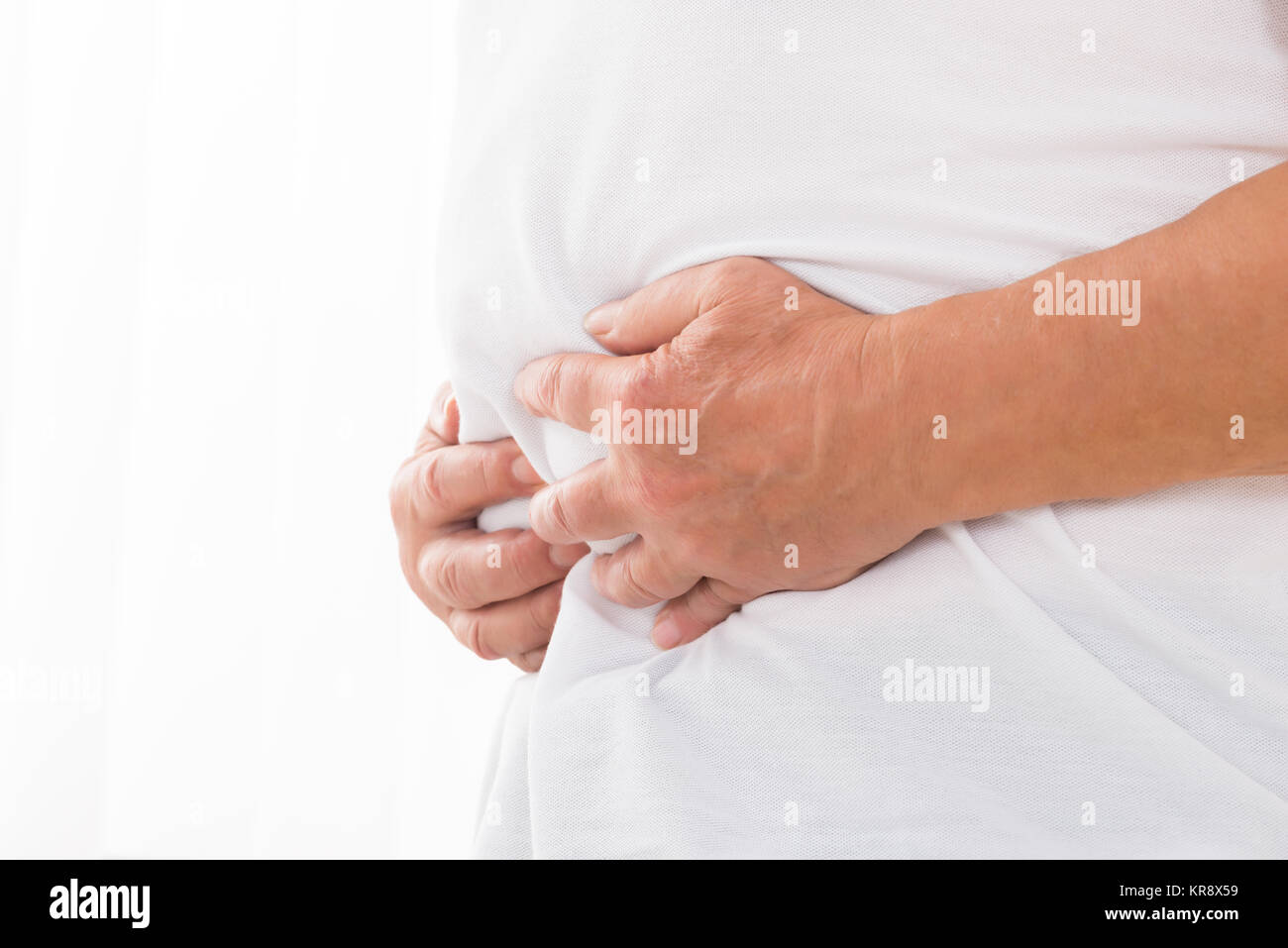 Person Suffering From Stomach Ache Stock Photo - Alamy