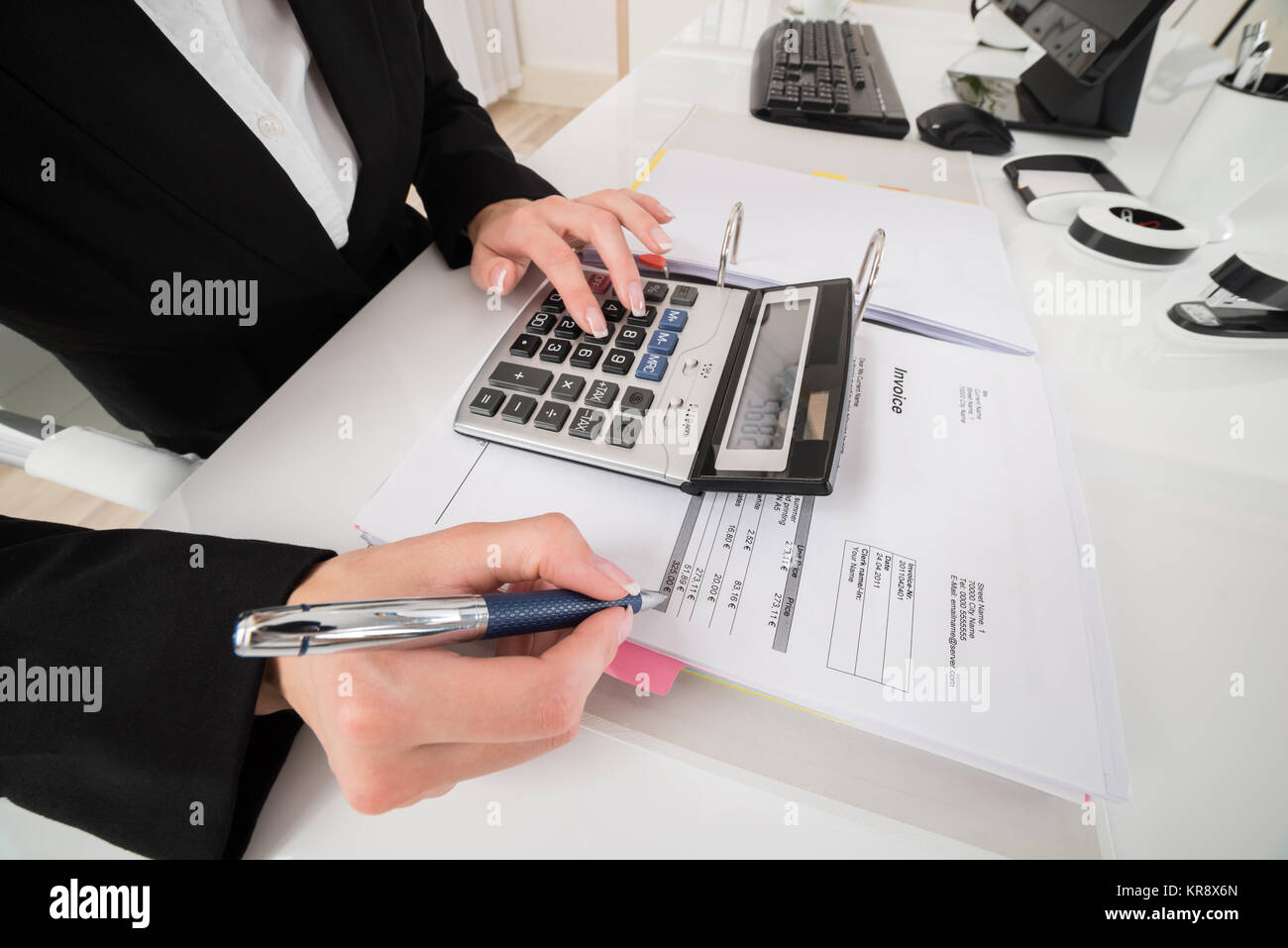 Accountant Calculating Data At Desk Stock Photo - Alamy