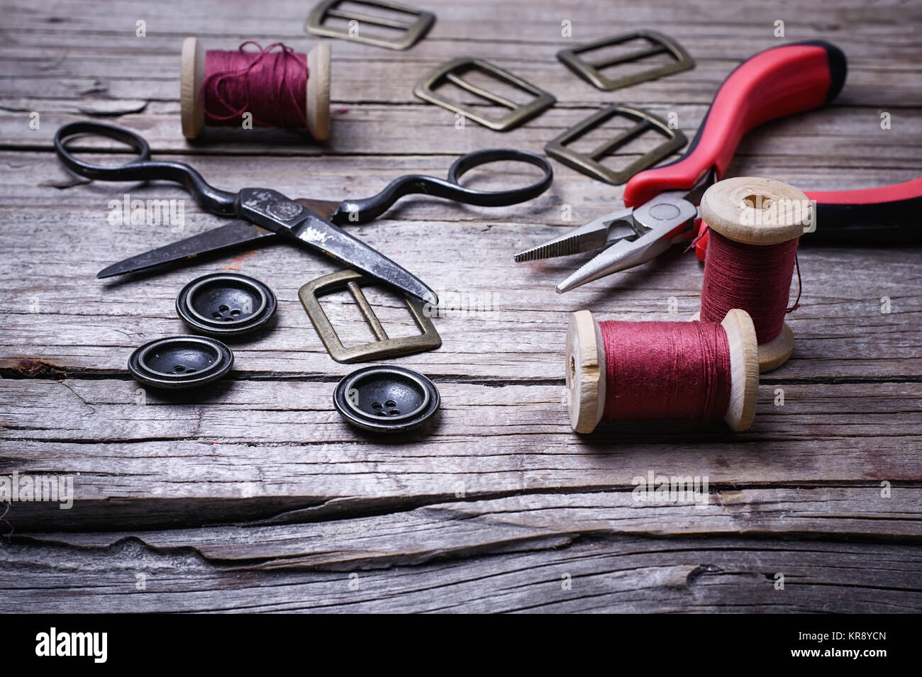 Buttons and fasteners from outdated clothes on wooden background Stock ...
