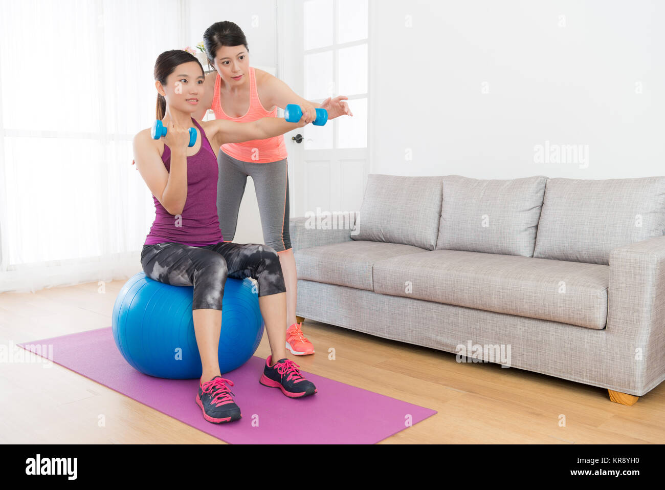 pretty attractive home fitness tutor woman teaching her student workout ...