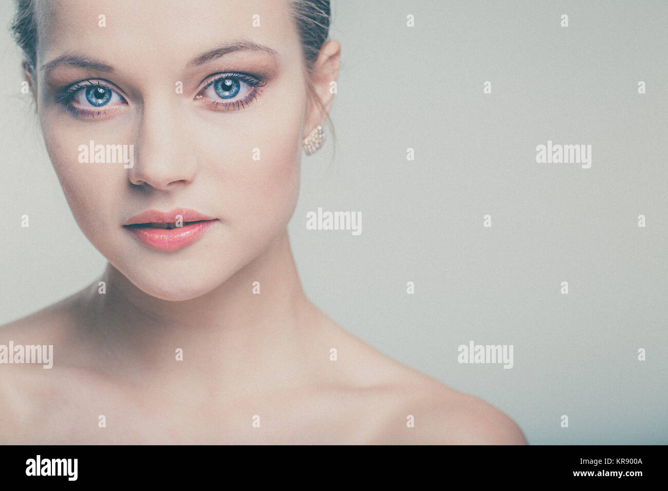 Beautiful young woman with perfect skin and face (color toned image ...