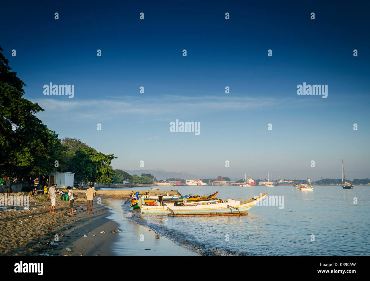 coast with traditional fishing boats on dili beach in east timor leste ...