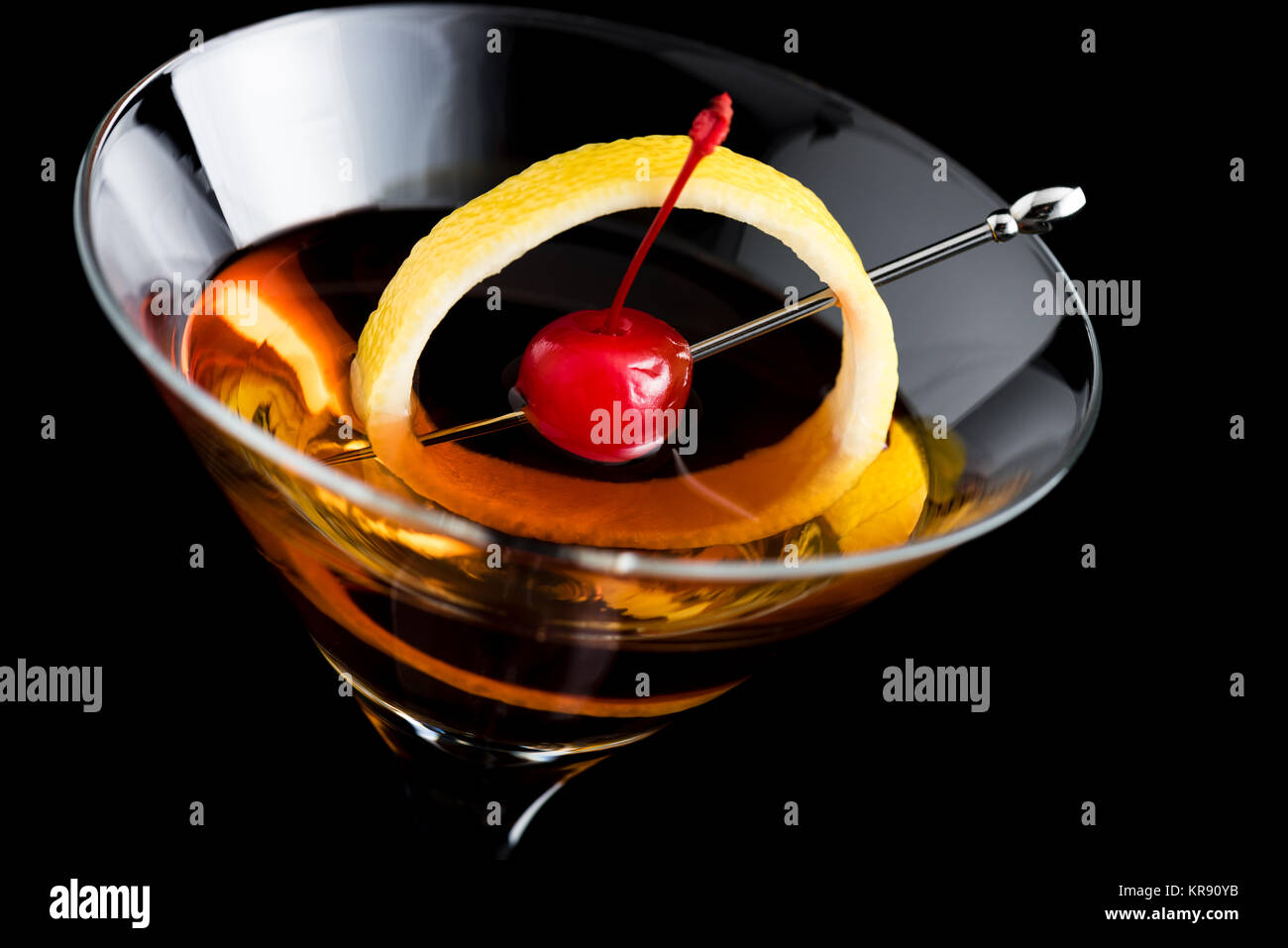 Manhattan cocktails on black background with garnish Stock Photo - Alamy