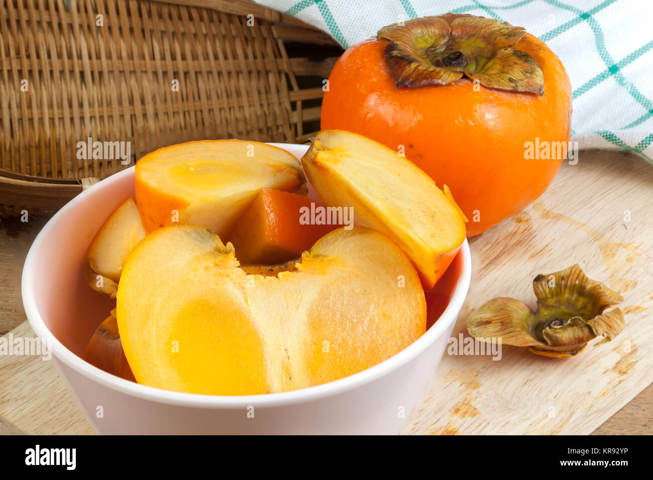 Persimmon yellow color fruits Stock Photo - Alamy