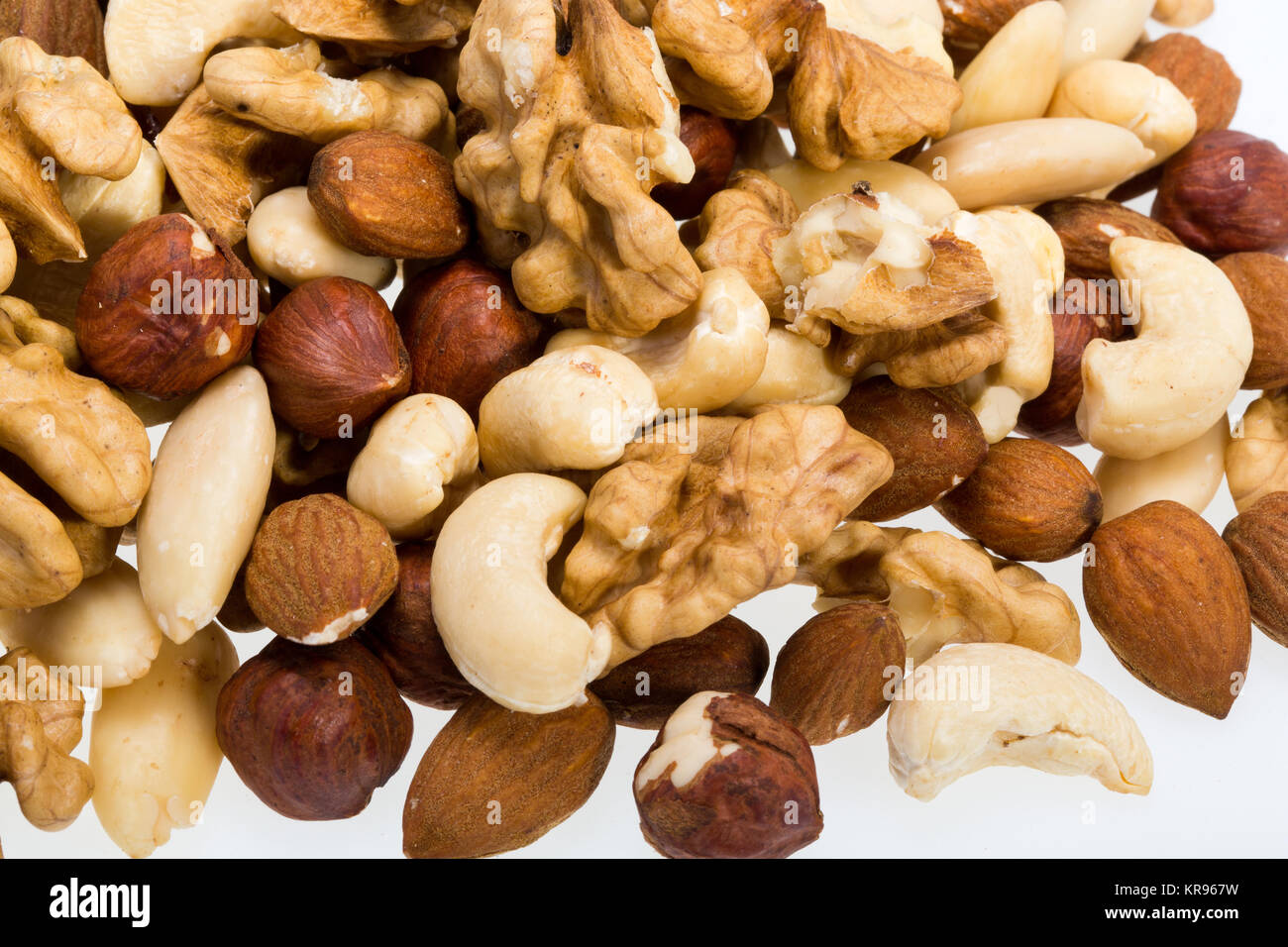 mixed nuts and dried fruits isolated on white background Stock Photo ...