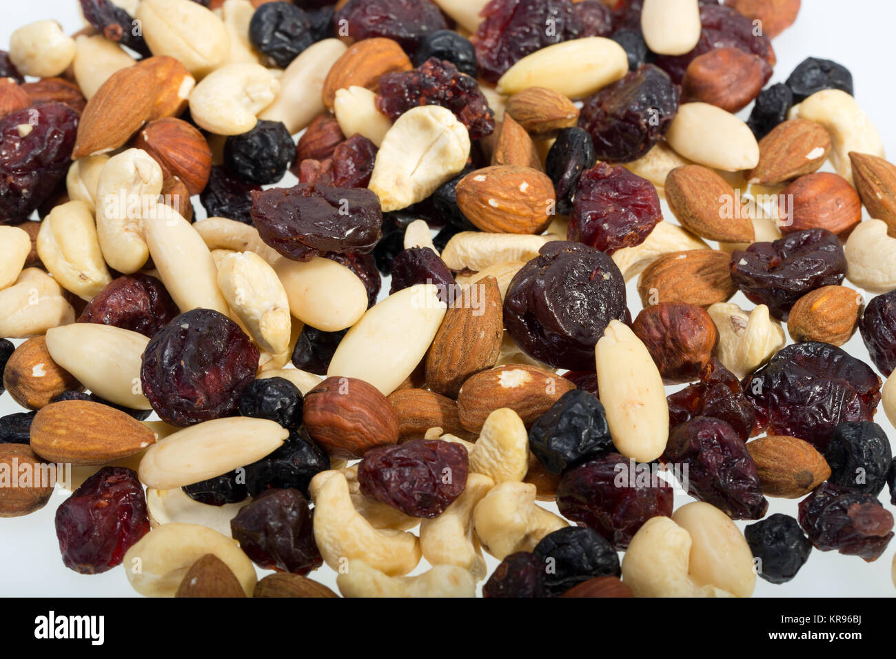 mixed nuts and dried fruits isolated on white background Stock Photo ...