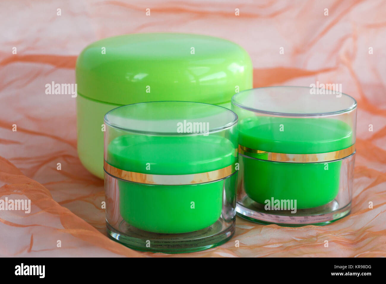 Set of three green cosmetic cream bottles Stock Photo - Alamy