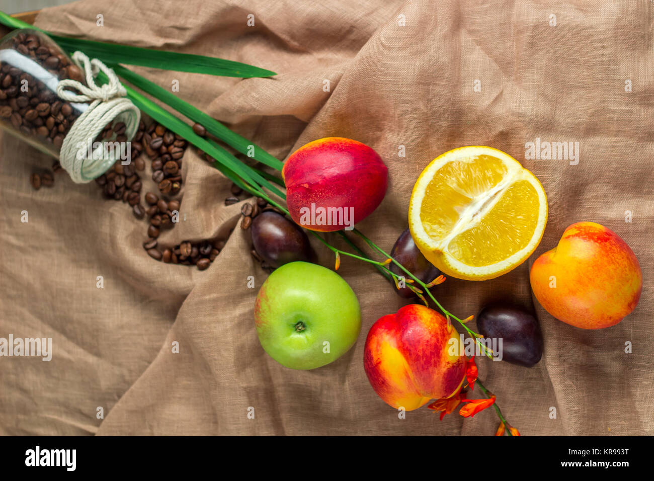 Still life on bagging background: apple, peaches, orance, plums Stock ...