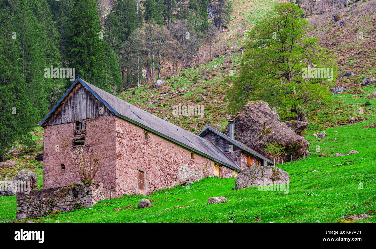Traditional wall stone stable and house Stock Photo - Alamy