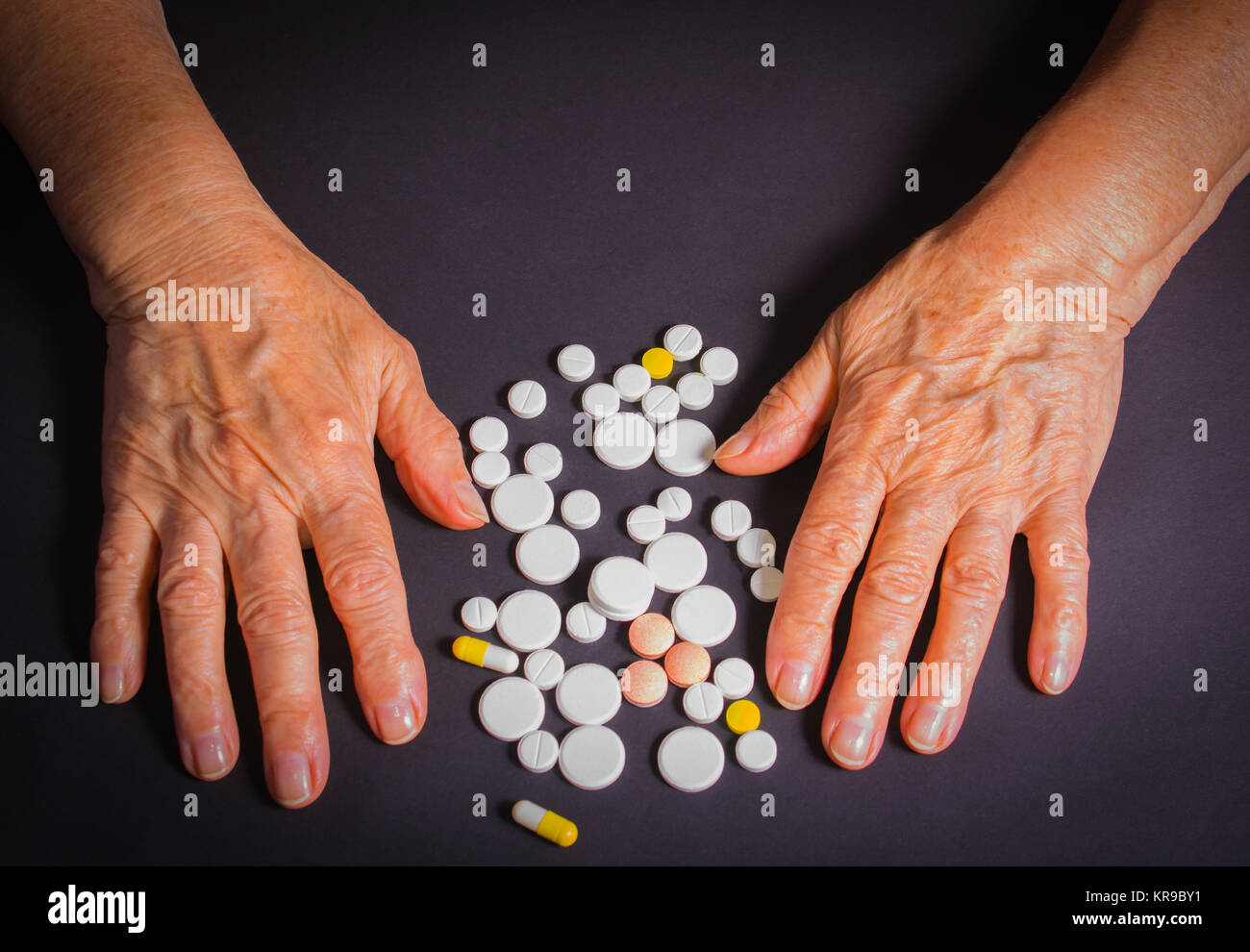 The old hands with pills Stock Photo - Alamy