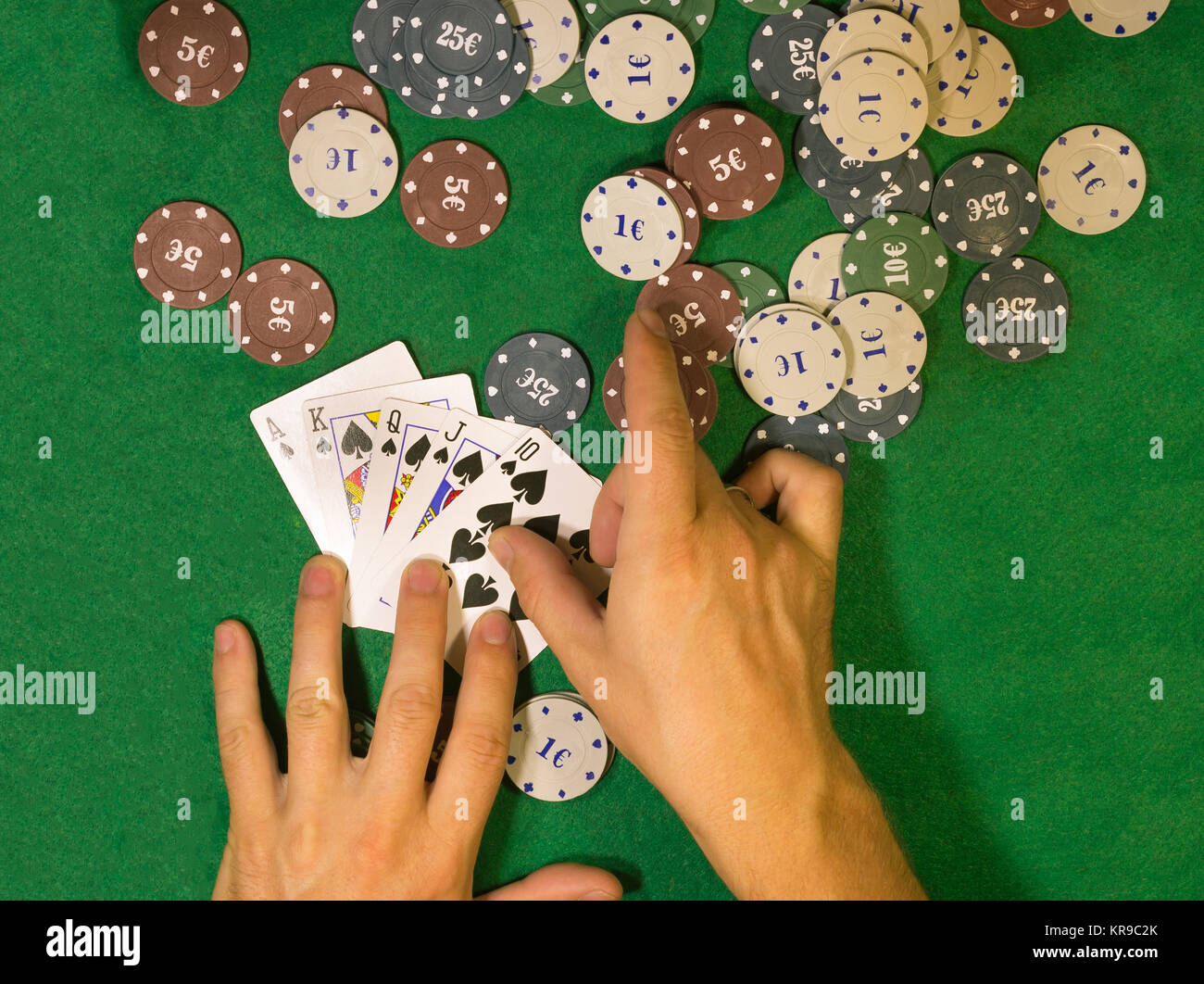 The male hands with cards in casino Stock Photo - Alamy