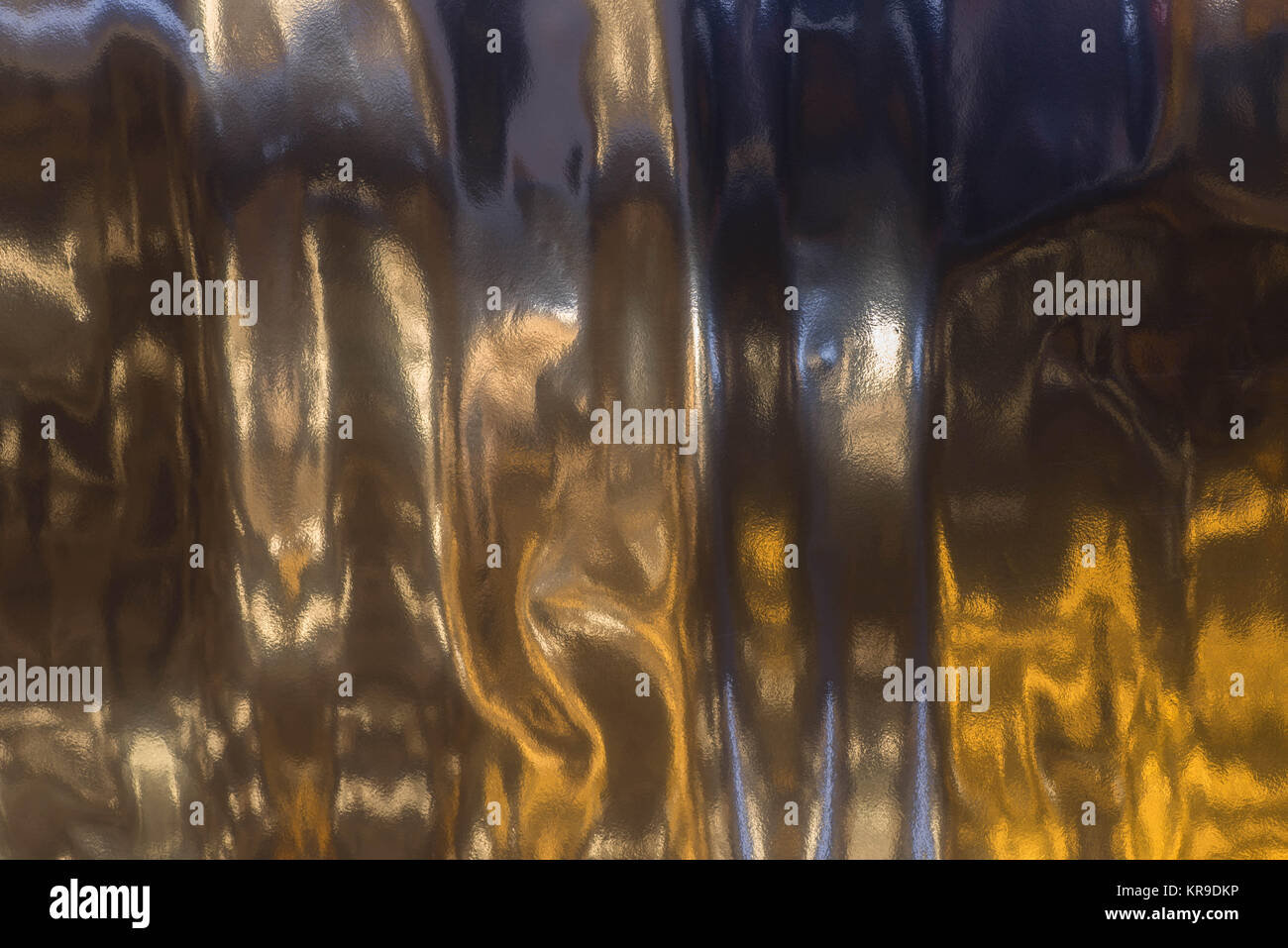 golden color folded metallic foil abstract bacgkground Stock Photo - Alamy