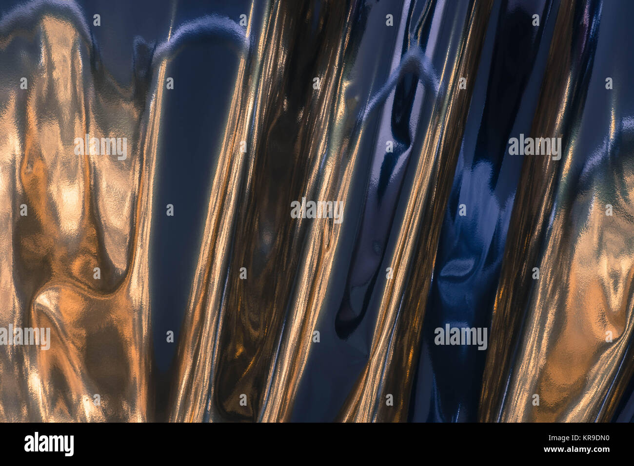 golden color folded metallic foil abstract bacgkground Stock Photo - Alamy
