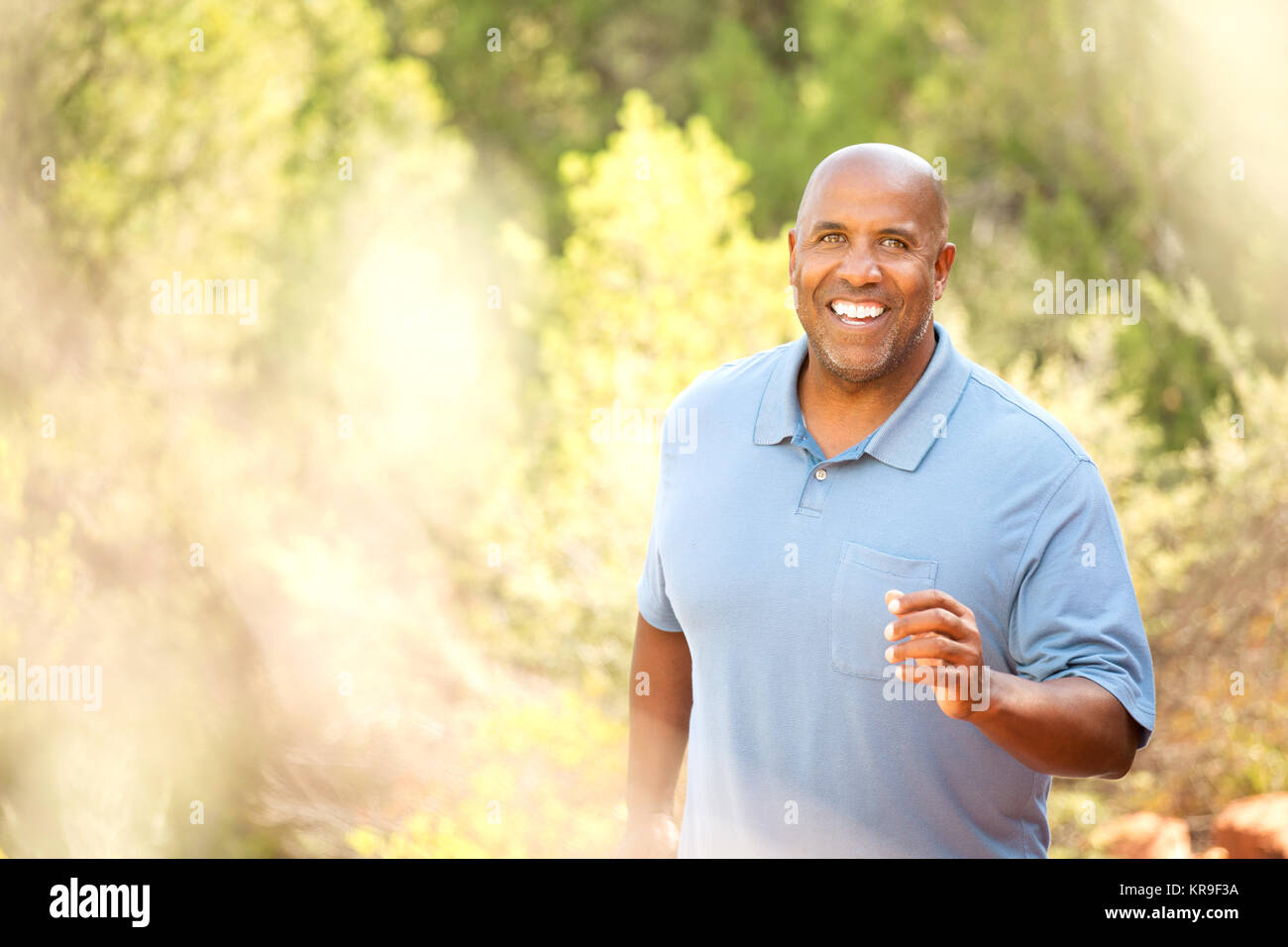 African American man jogging outside Stock Photo - Alamy