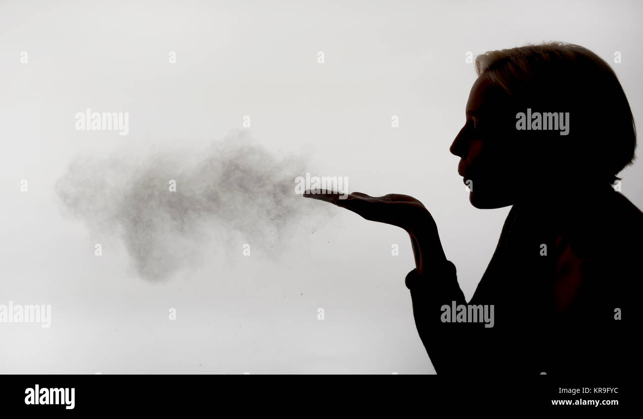 woman blows dust Stock Photo - Alamy