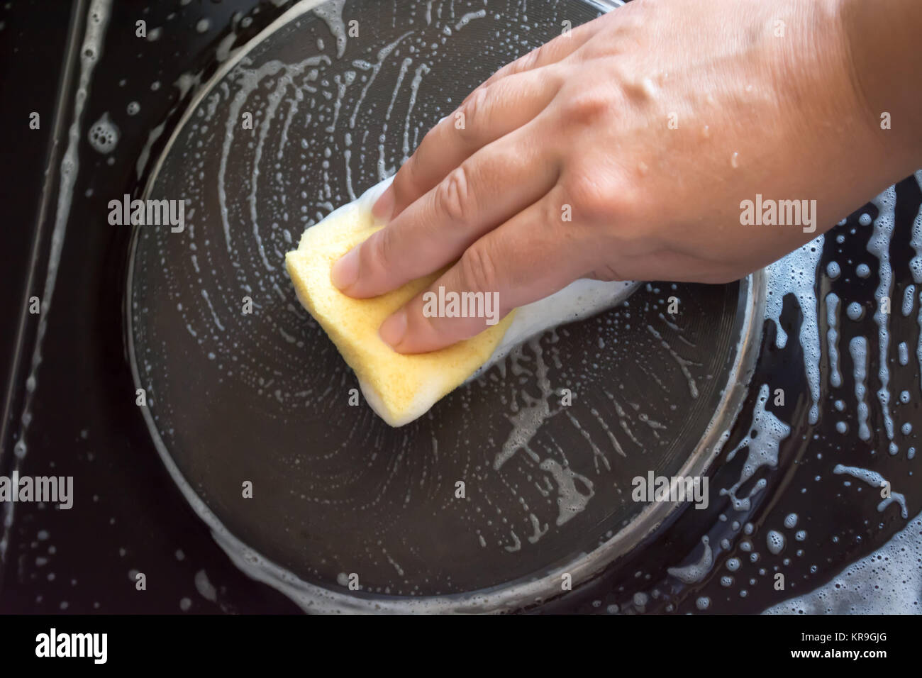 Kitchen cleaning time Stock Photo - Alamy