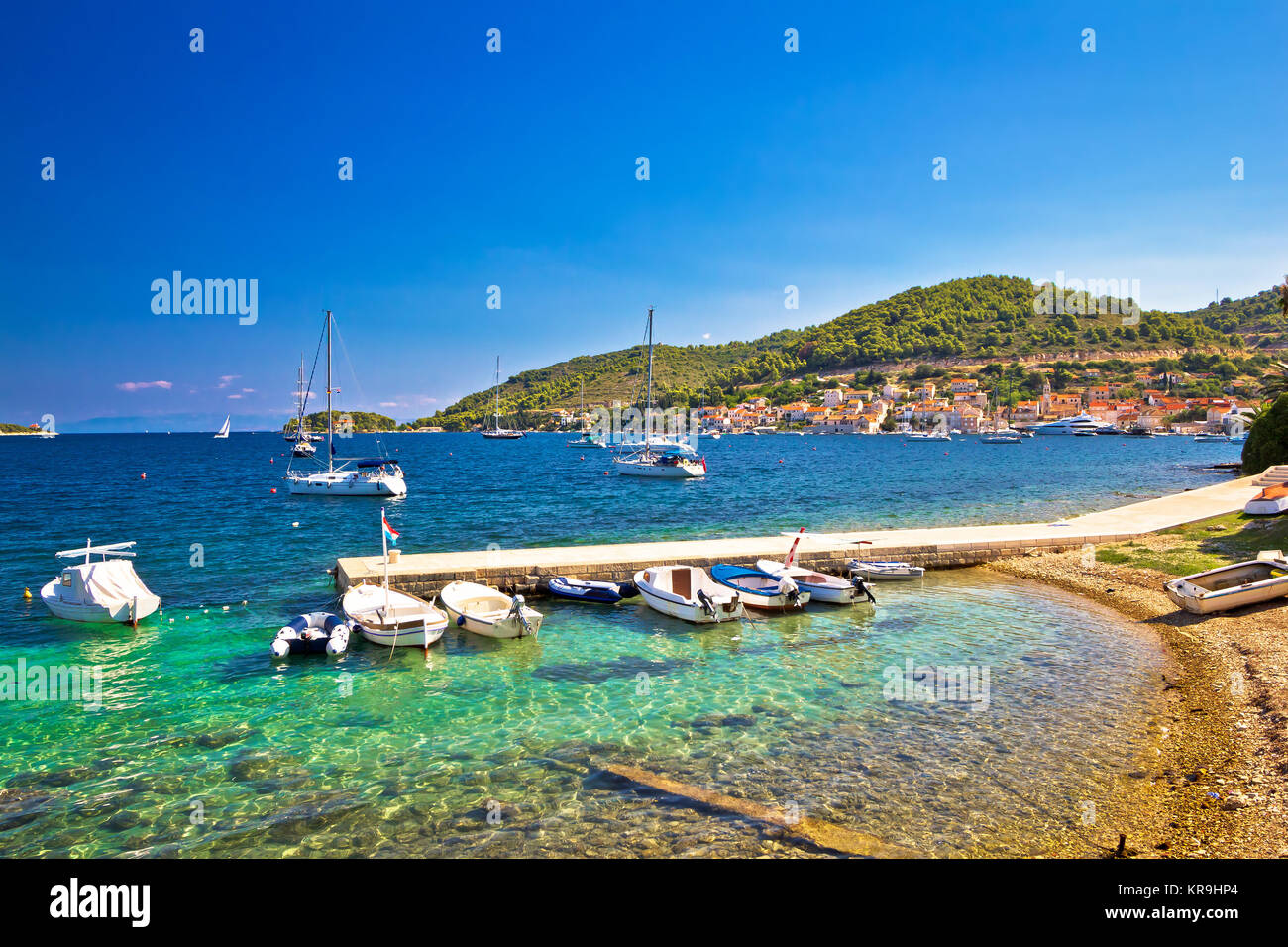 Turquoise beach and small harbor on Vis Stock Photo - Alamy