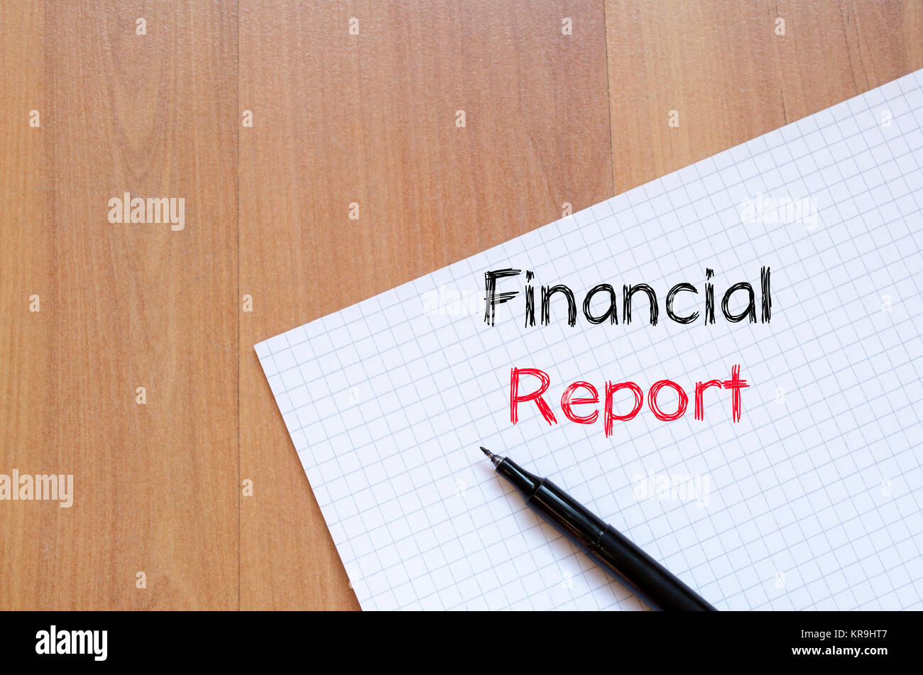 Financial report text concept on notebook Stock Photo - Alamy