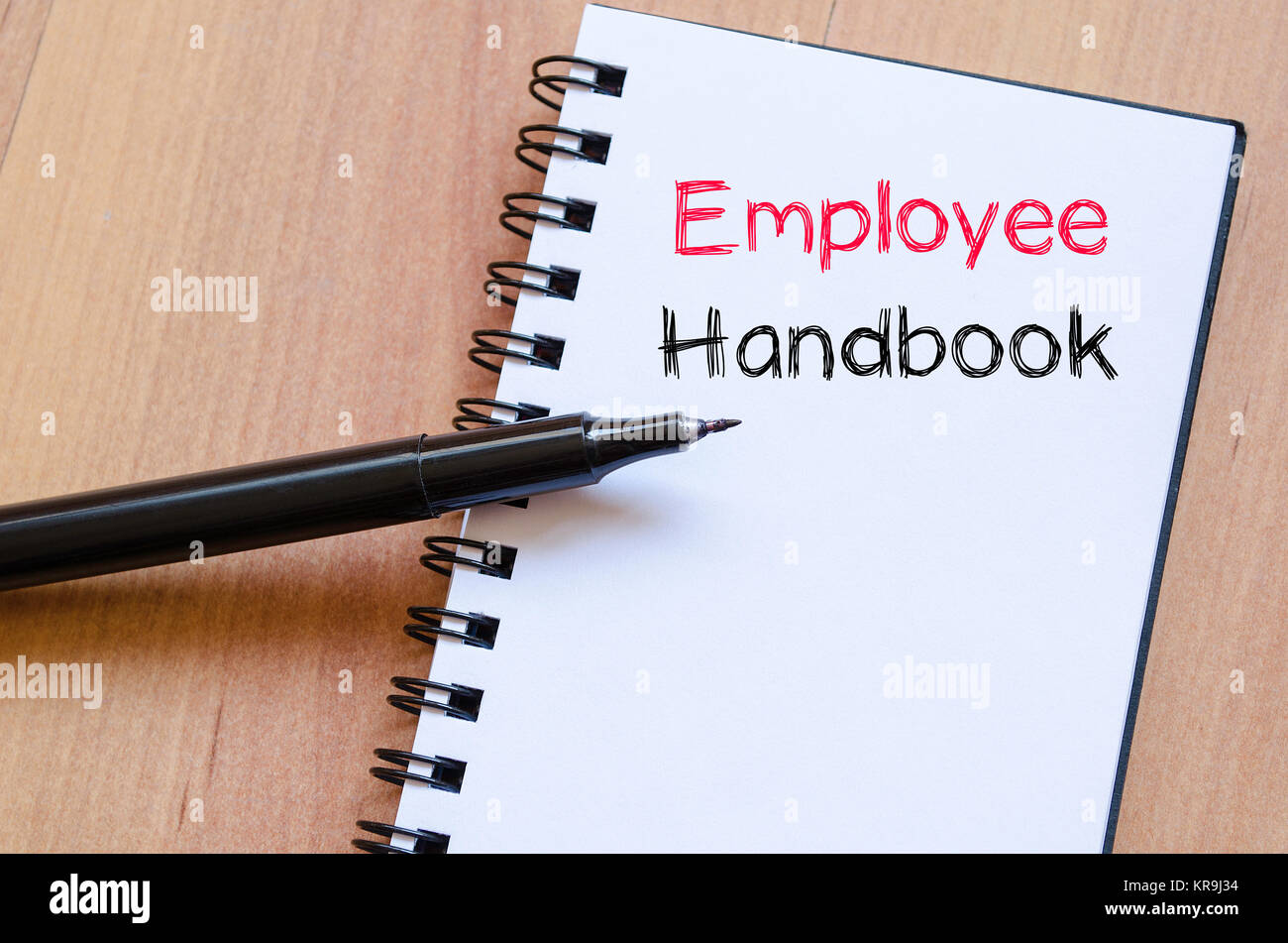 Employee handbook text concept on notebook Stock Photo - Alamy