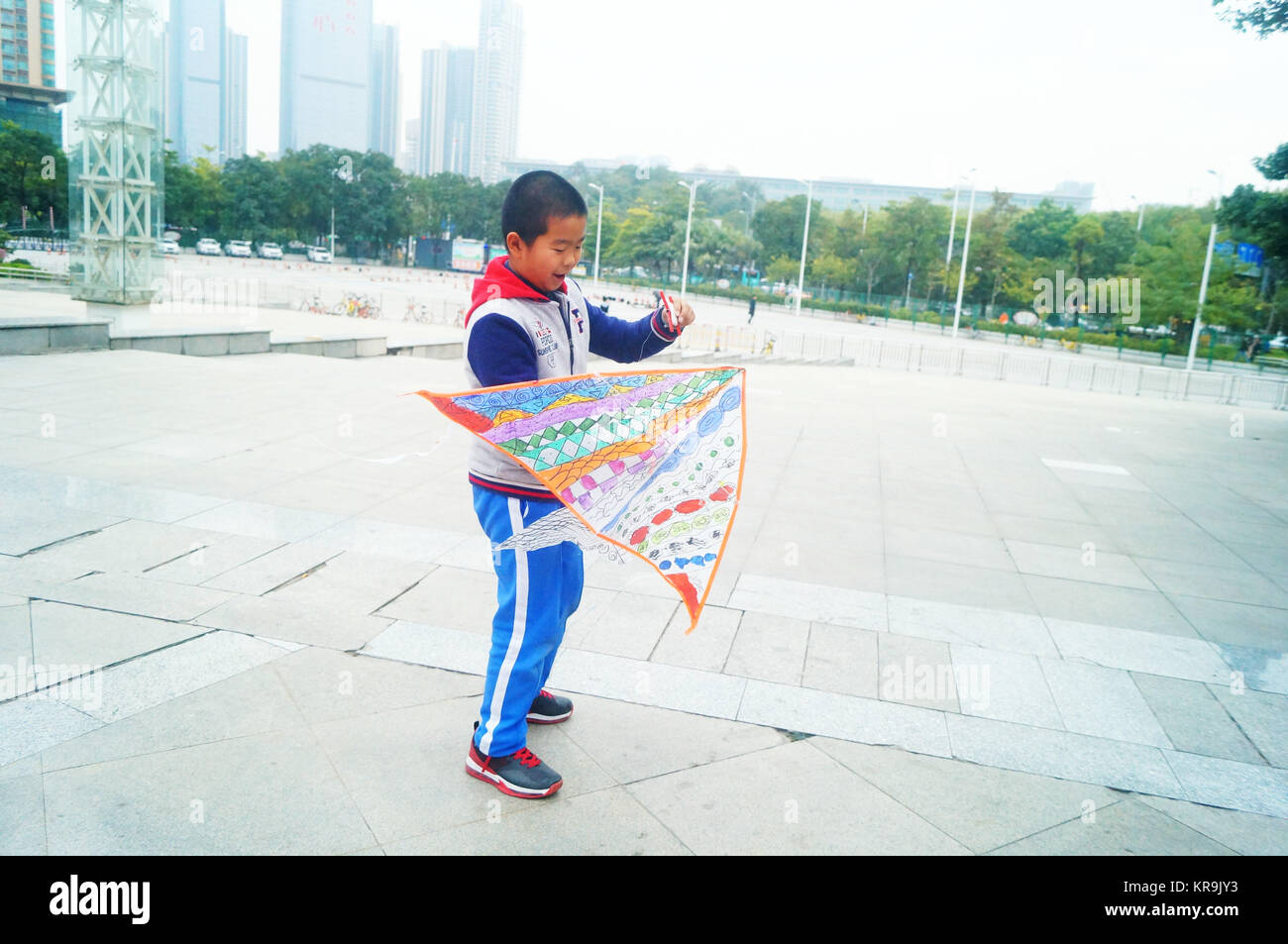 Shenzhen, China: Boys playing kites in the Sports Square Stock Photo ...