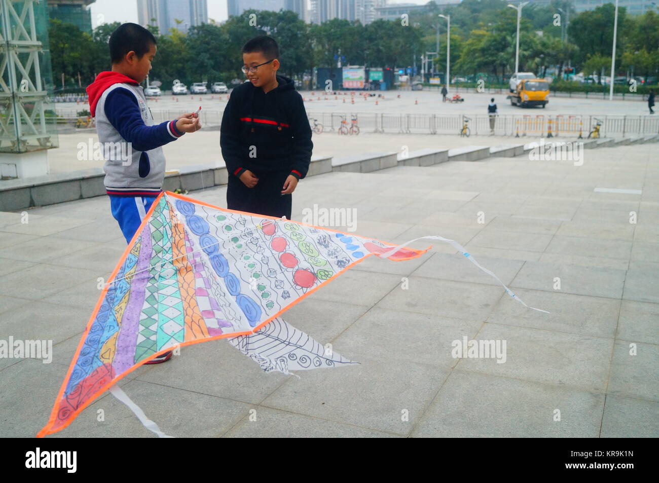 Shenzhen, China: Boys playing kites in the Sports Square Stock Photo ...
