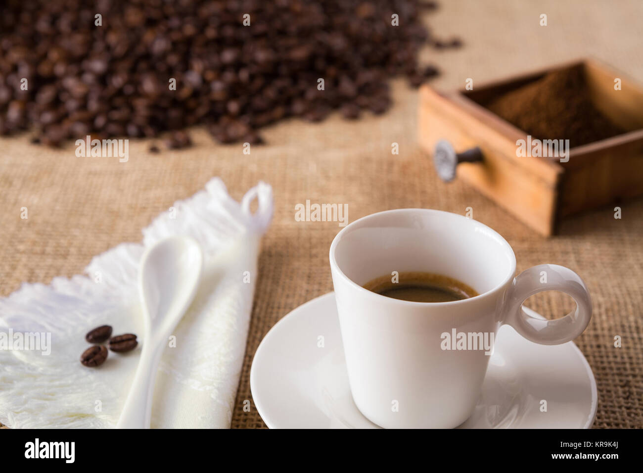 Coffee with coffee-beans on jute Stock Photo - Alamy