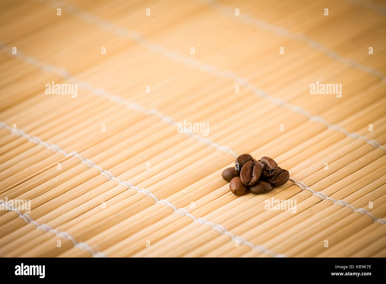 Coffee-beans on bamboo Stock Photo - Alamy
