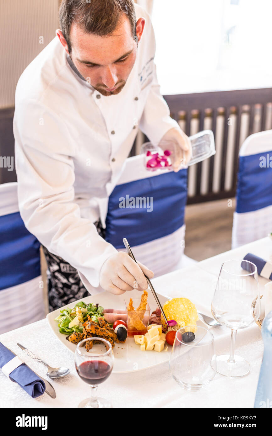 Chef decorating appetizer plate Stock Photo - Alamy