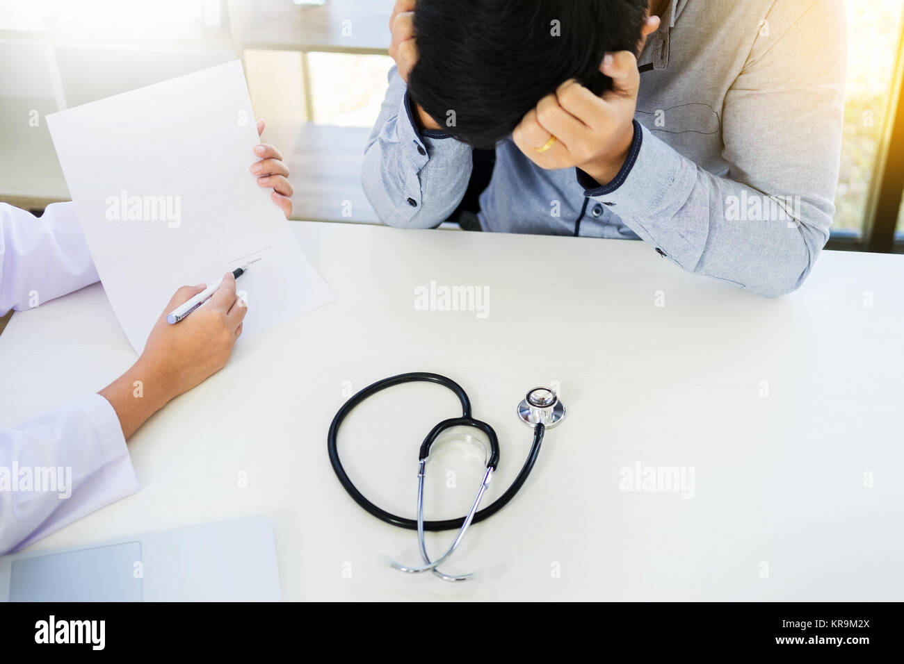 Doctor Comforting Crying Patient High Resolution Stock Photography and ...