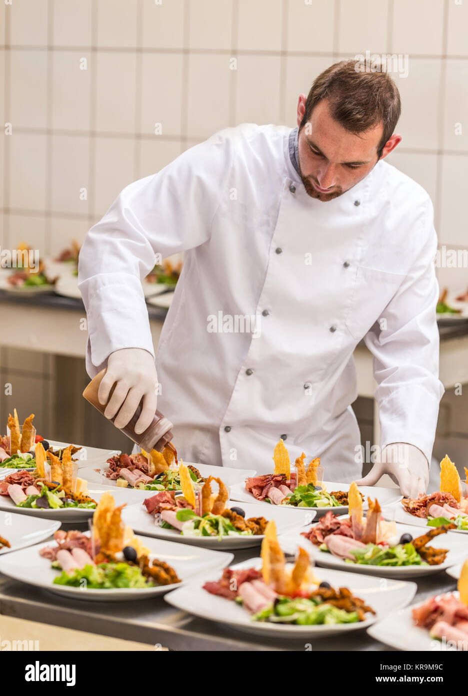 Chef decorating appetizer plate Stock Photo - Alamy