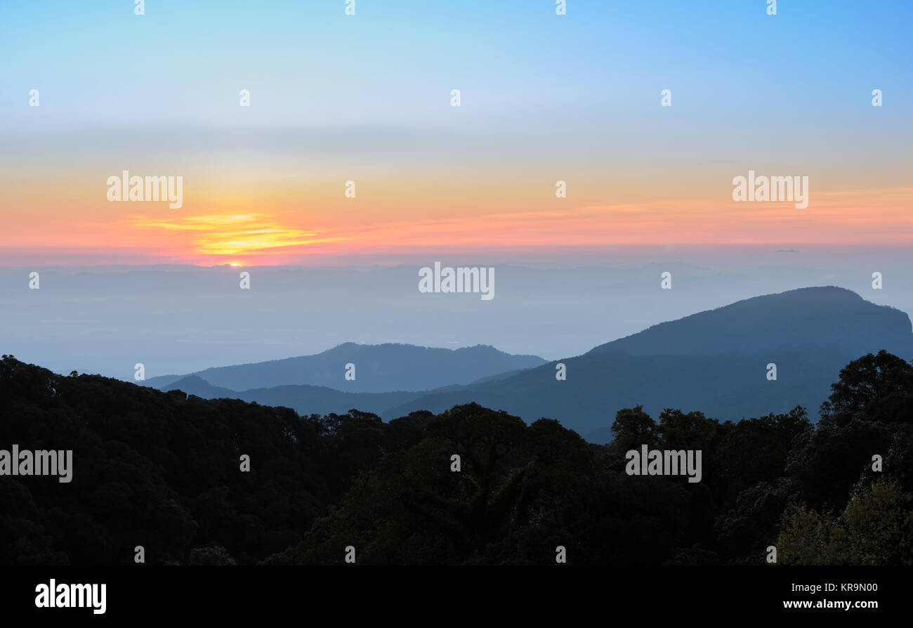 Landscape of sunrise over mountains Stock Photo - Alamy