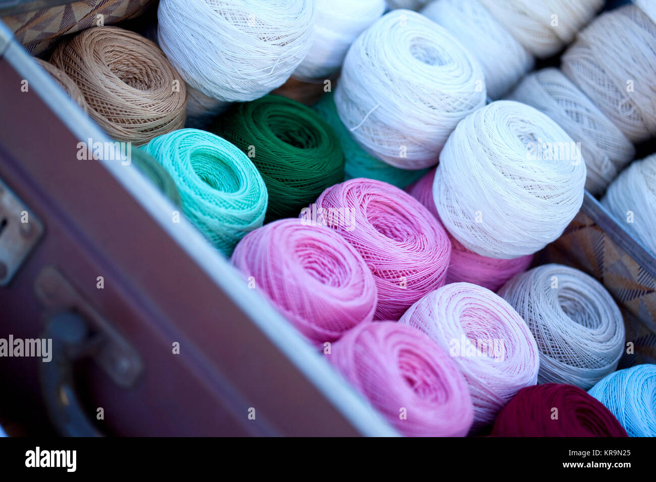 Yarn packages in a suitcase Stock Photo - Alamy