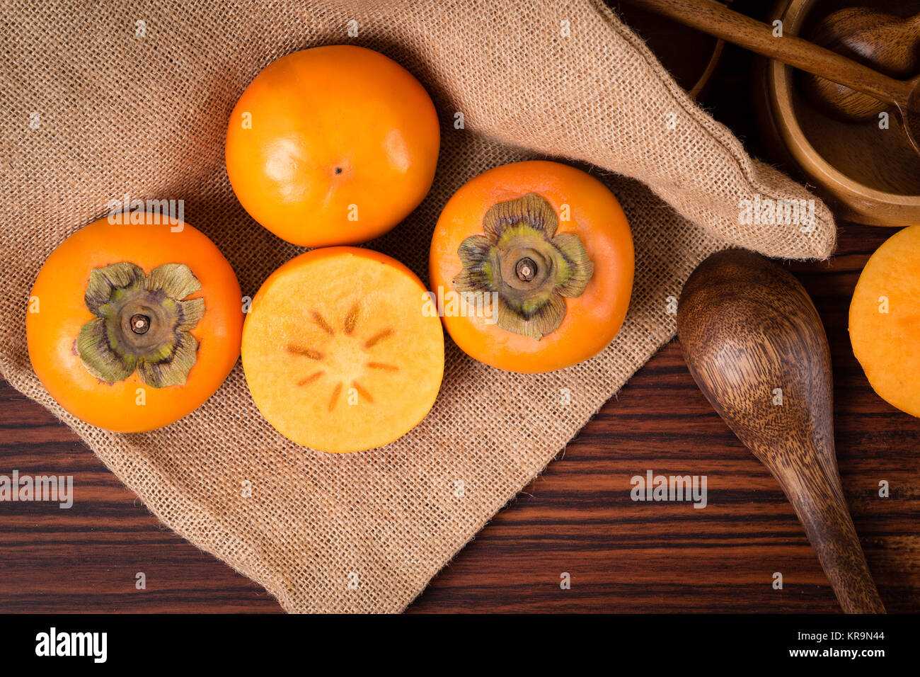 Organic and fresh persimmons Stock Photo - Alamy
