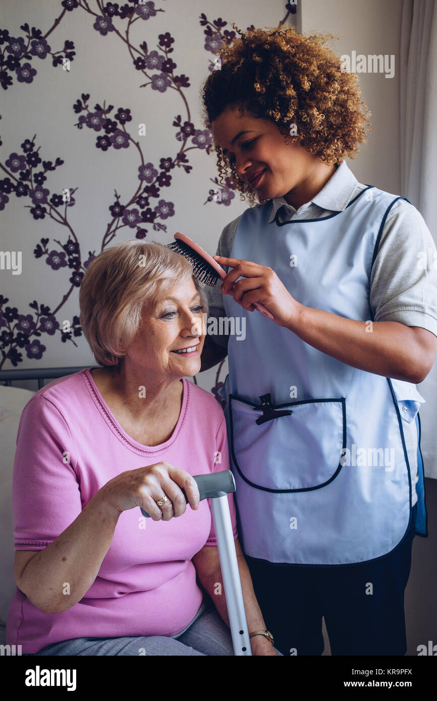 Carer Brushing Patients Hair Stock Photo - Alamy