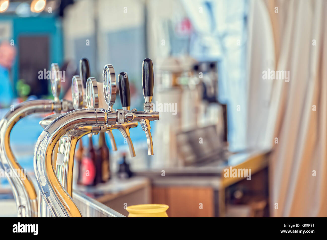 Draught beer taps and other beverages in a bar Stock Photo - Alamy