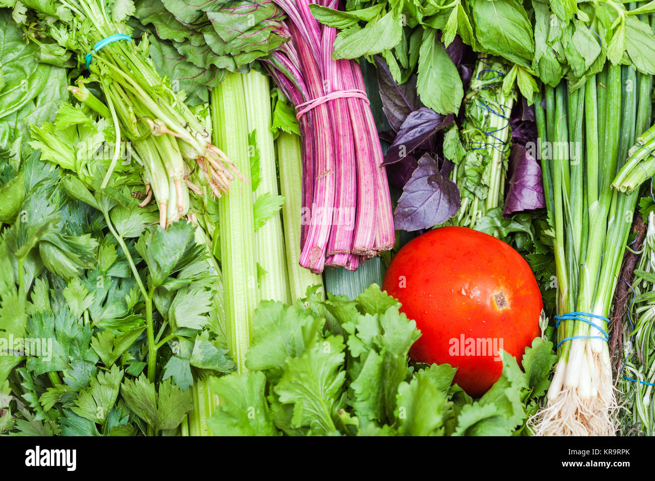 fresh greenery and red tomato Stock Photo - Alamy