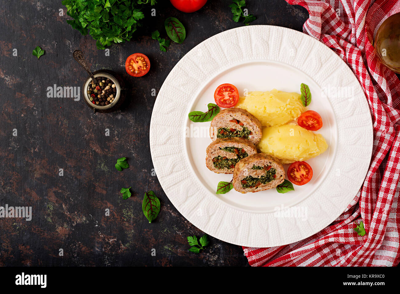 Roll of turkey minced meat with spinach and red sweet pepper with ...