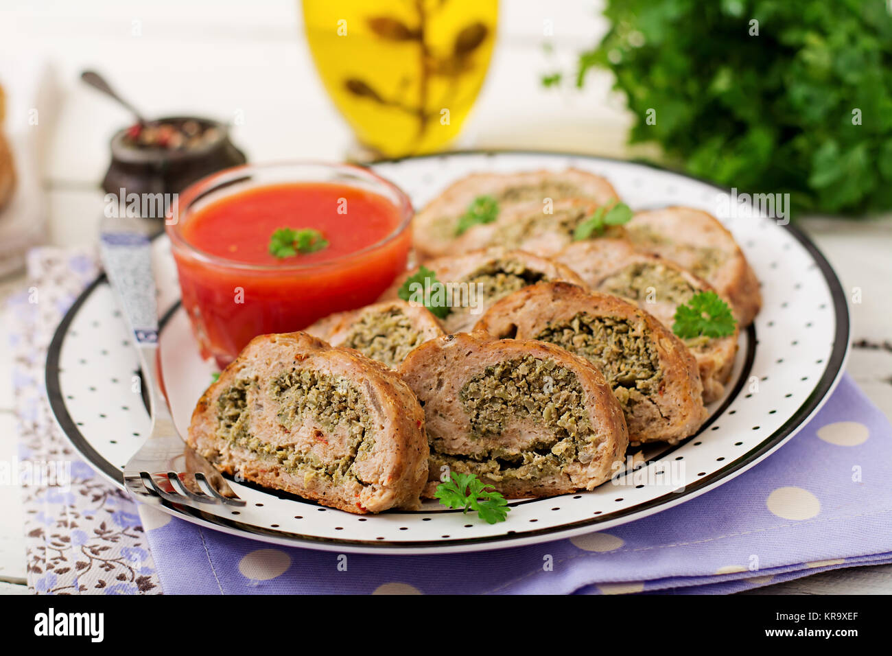 Roll of chicken minced meat with broccoli and tomato sauce Stock Photo ...